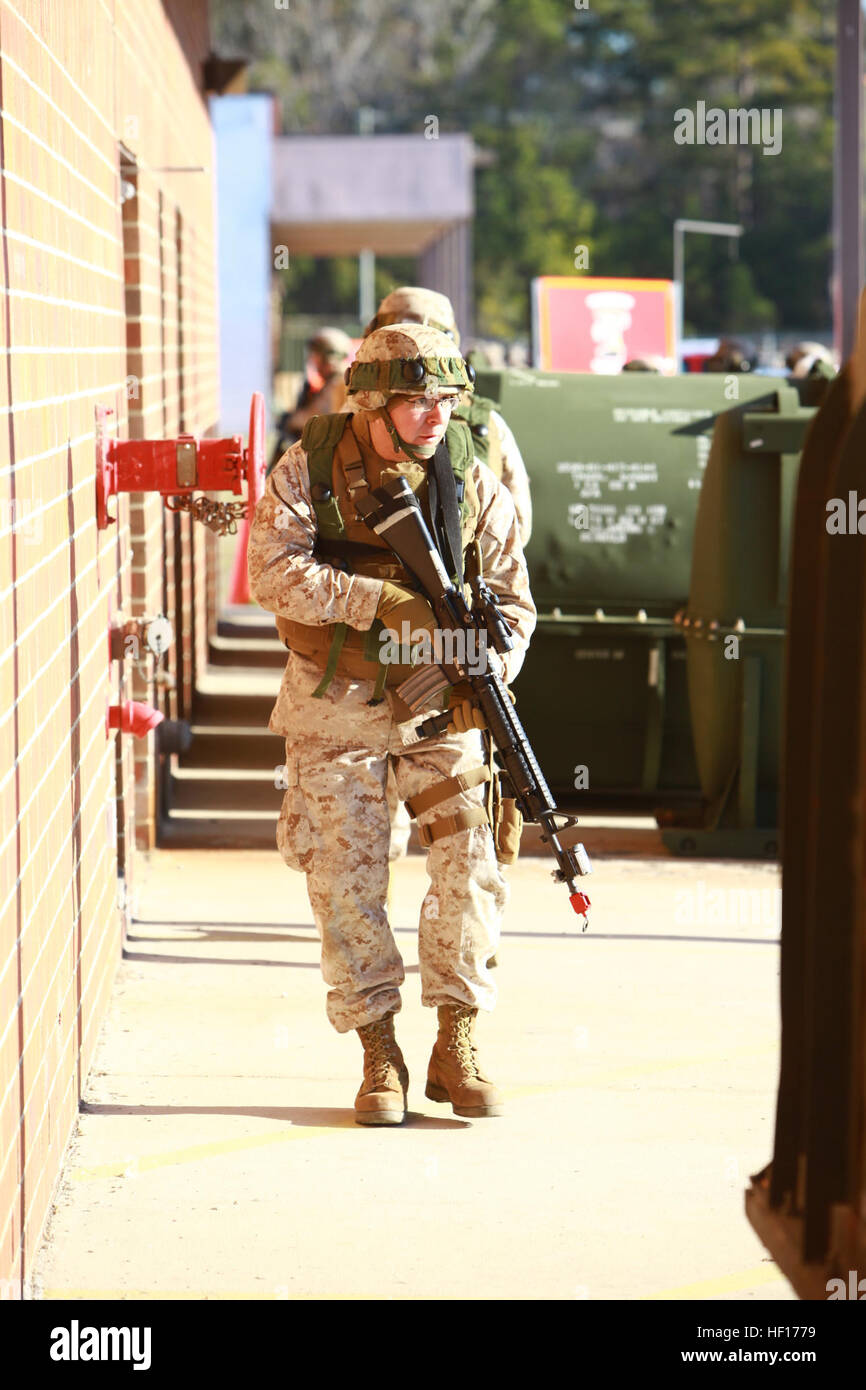 A rear-security guard protects the flank of a fire team during a ...