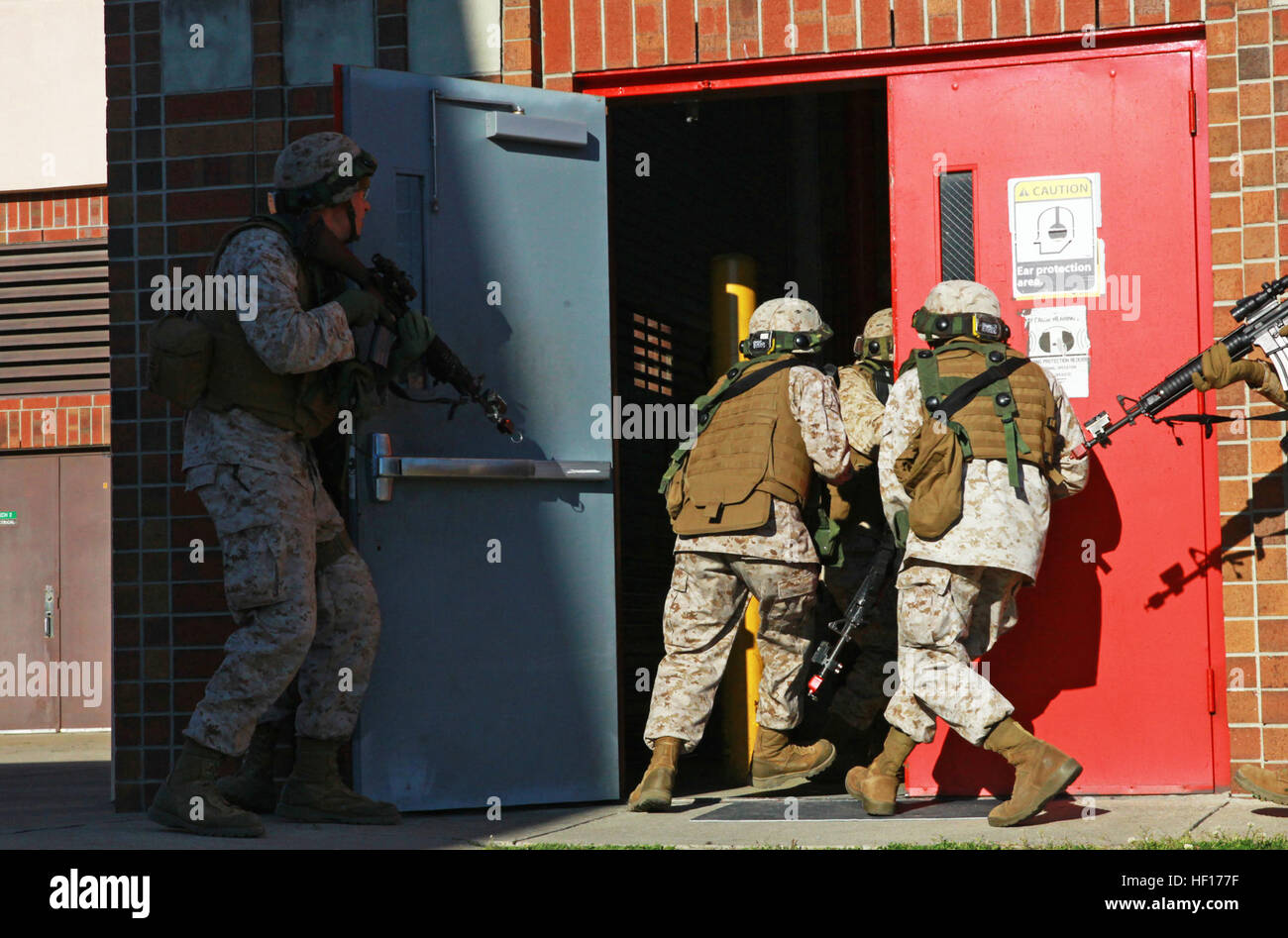 Marines storm through a door during a training exercise held by 2nd ...