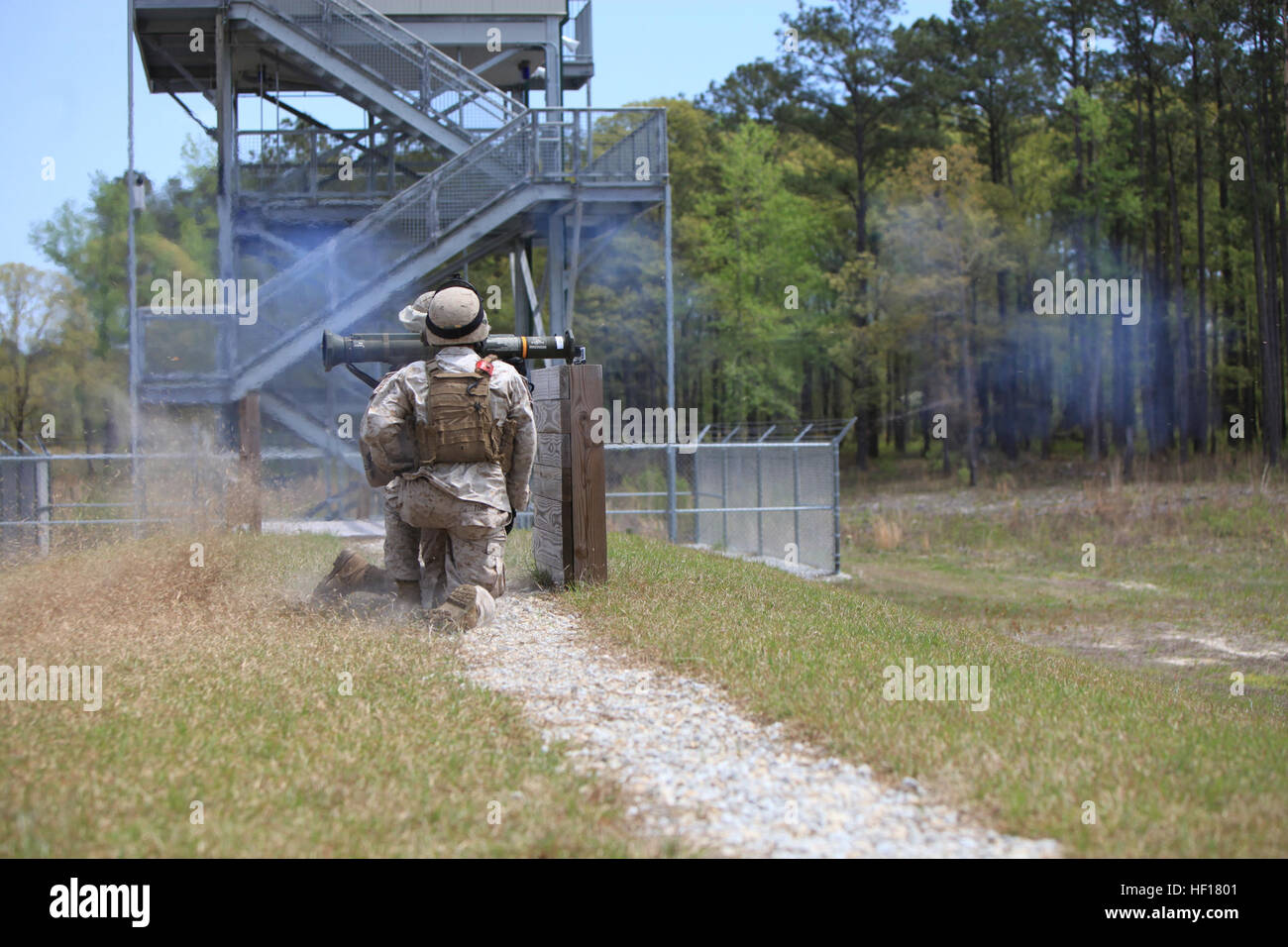 Pfc. Colby Williams fires an AT-4 rocket at a simulated dummy tank ...