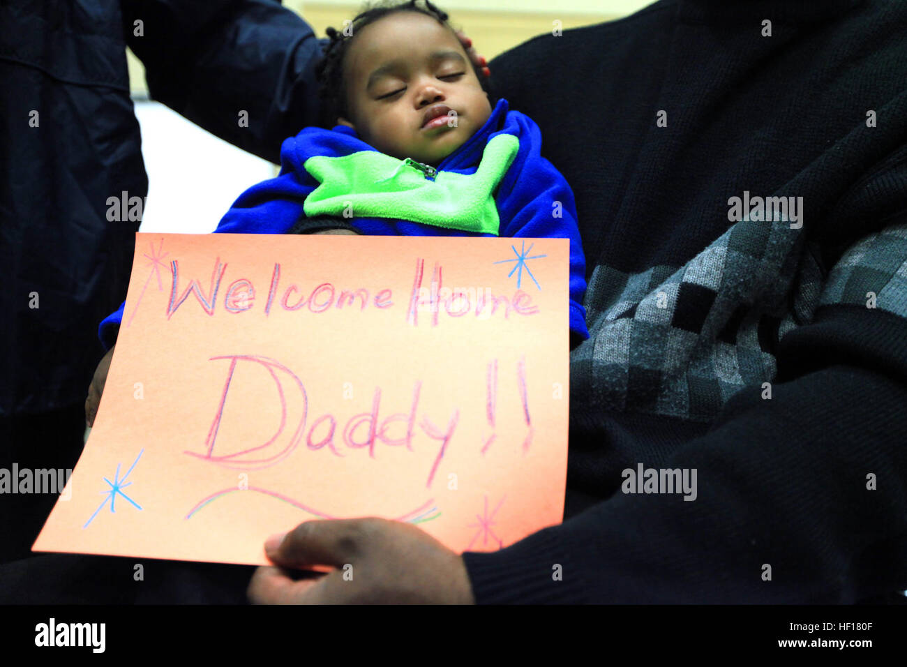 One-year-old Elijah Austin waits for his father, Cpl. Isaiah Austin, a ...