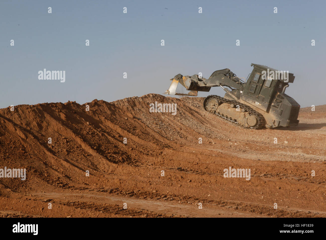 U.S. Navy Equipment Operator Third Class John Harmon, a heavy equipment ...