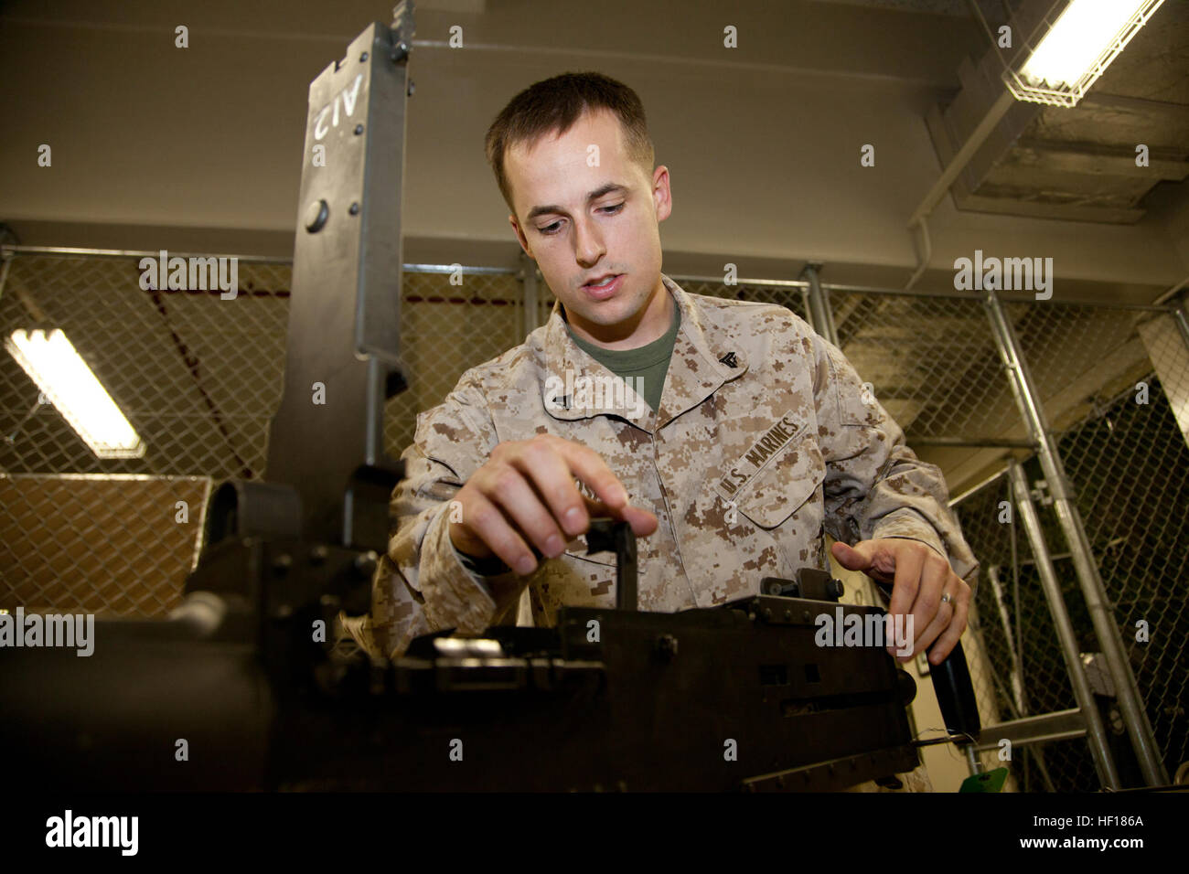 Cpl. Jason D. Dospoy assesses parts of an M2 .50-caliber Browning ...