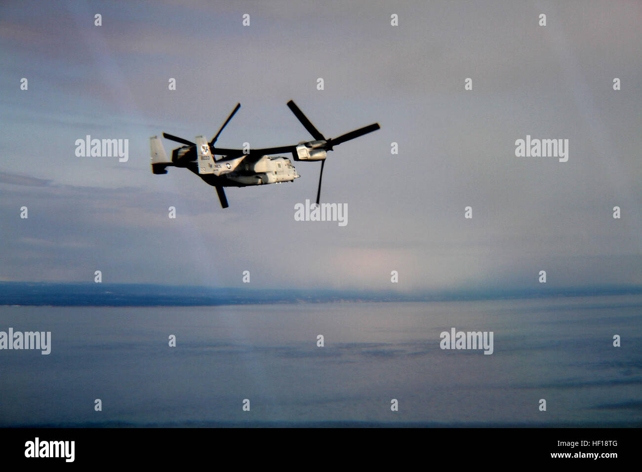Over open waters, an MV-22B Osprey from VMM-161 flies out to meet the ...