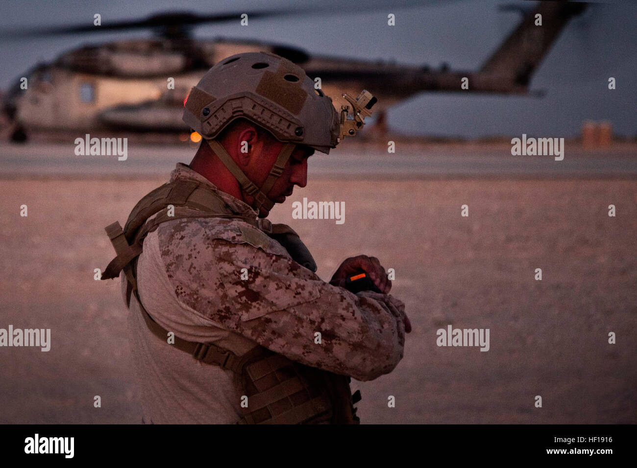 A Marine from 1st Reconnaissance Battalion boards a CH-53D Sea Stallion ...