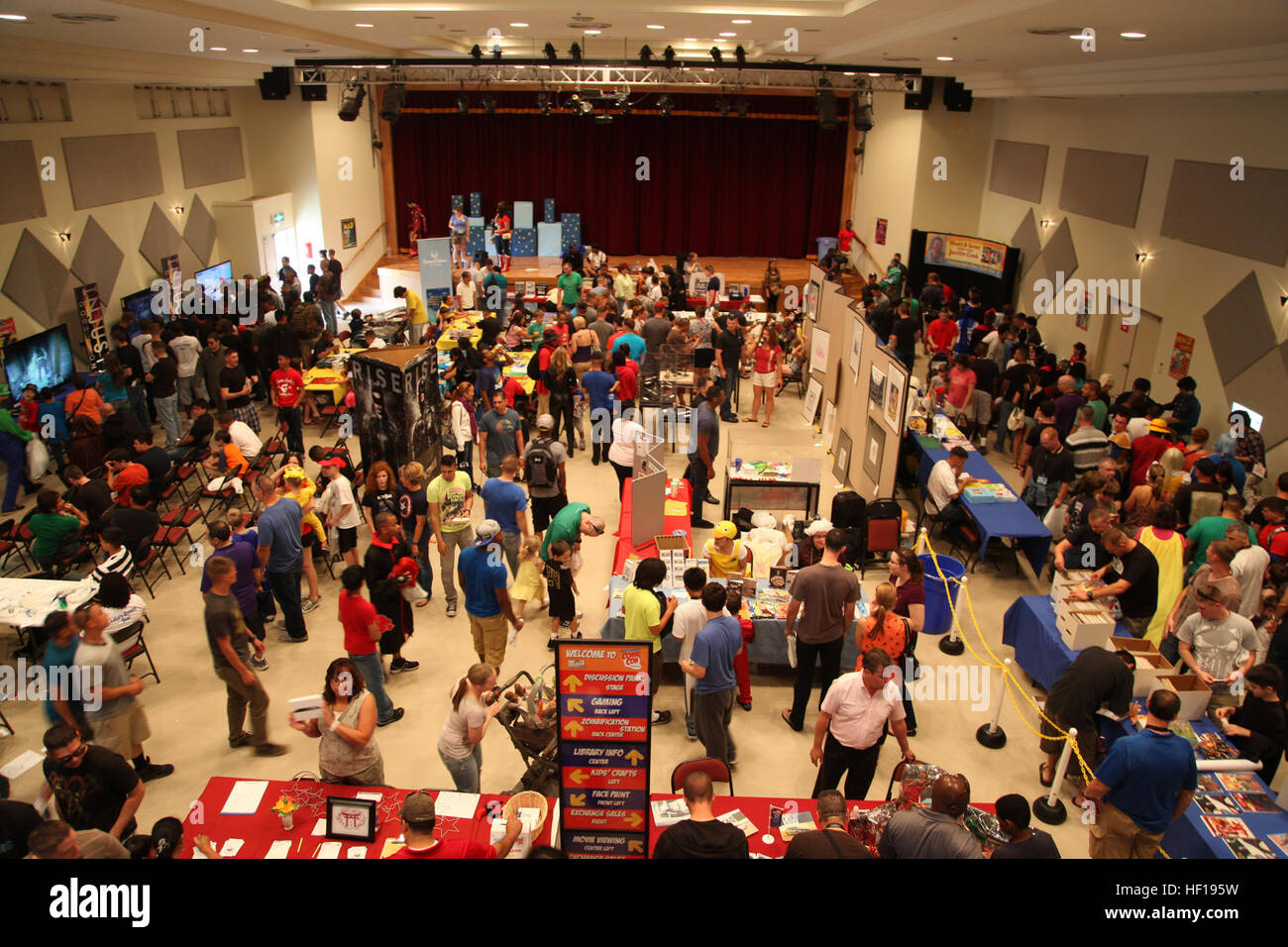 Attendees visit displays during the third annual Comic Con Okinawa ...