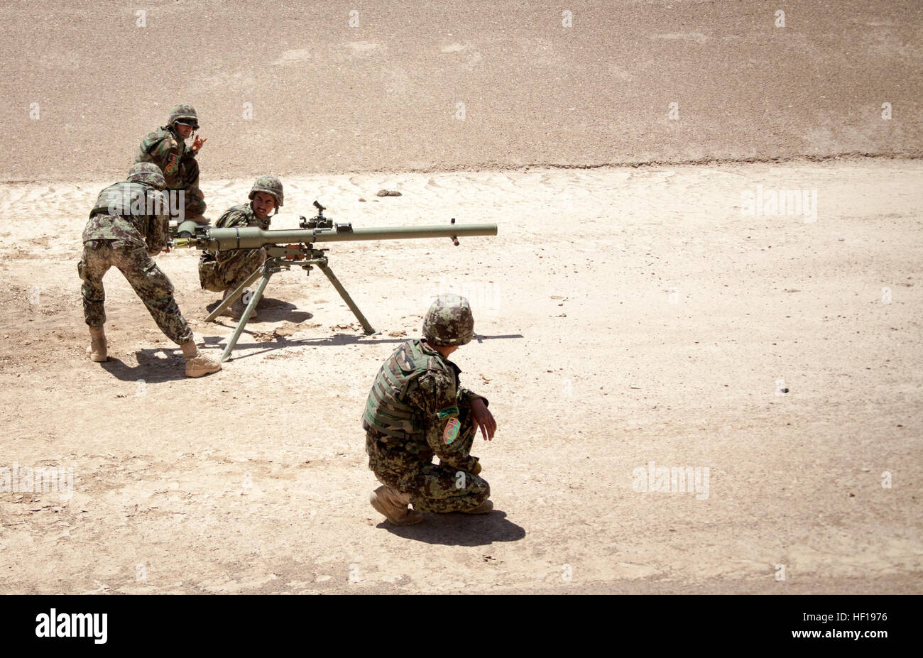 Afghan National Army soldiers with the 215 Corps prepare to fire an SPG ...
