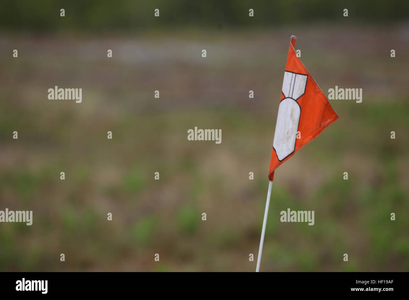 An orange flag marks unserviceable explosives during an explosive ...