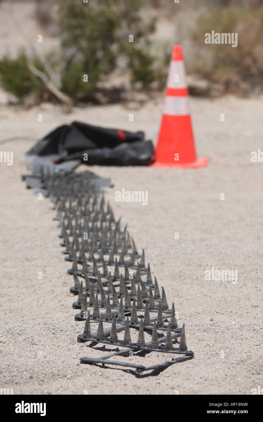 A spike strip set up by Marines with Combat Logistics Battalion 6, 2nd ...