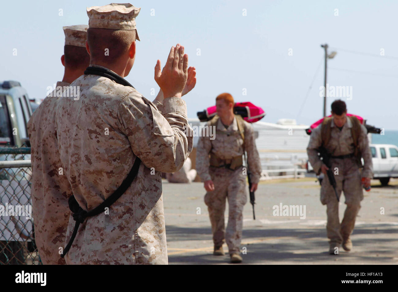 Basic Reconnaissance Course students applaud Sgt. Johnathan Bumpus and ...