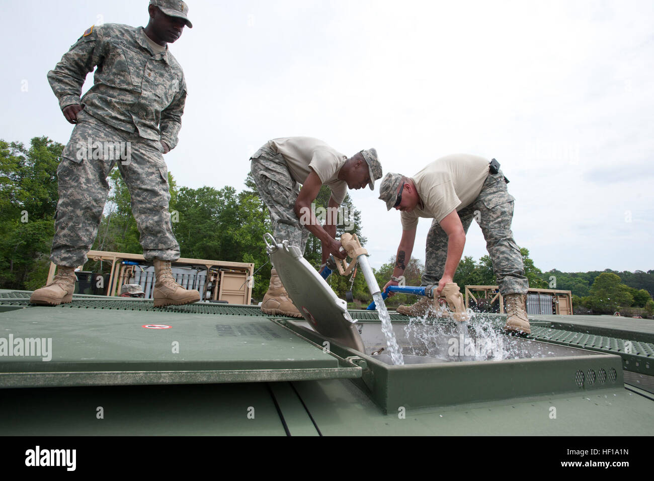 U.S. Army National Guard 2nd Lt. Anthony Ross observes Sgt. William ...