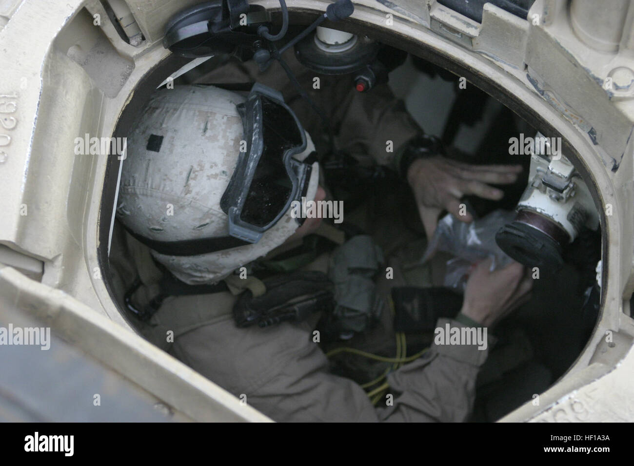 On Jan. 21, 2007 a Marine fixes a M1A1 Abrams Tank aboard Camp Fallujah ...