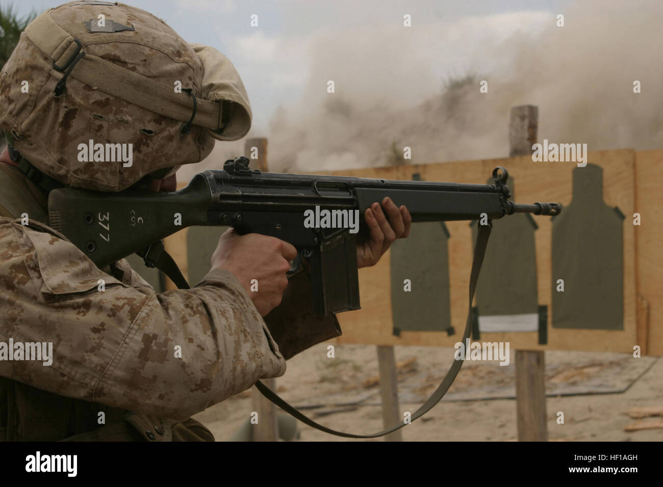 U.S. Marine Corps Sgt. Edward W. Deptola fires the G3 gun during an ...