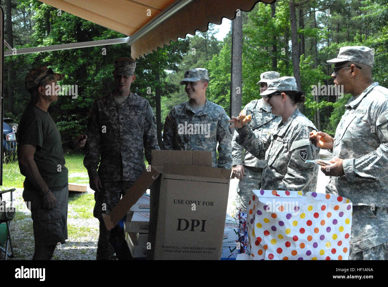 Bob Brown, (left), the USO of North Carolina mobile director, shares ...