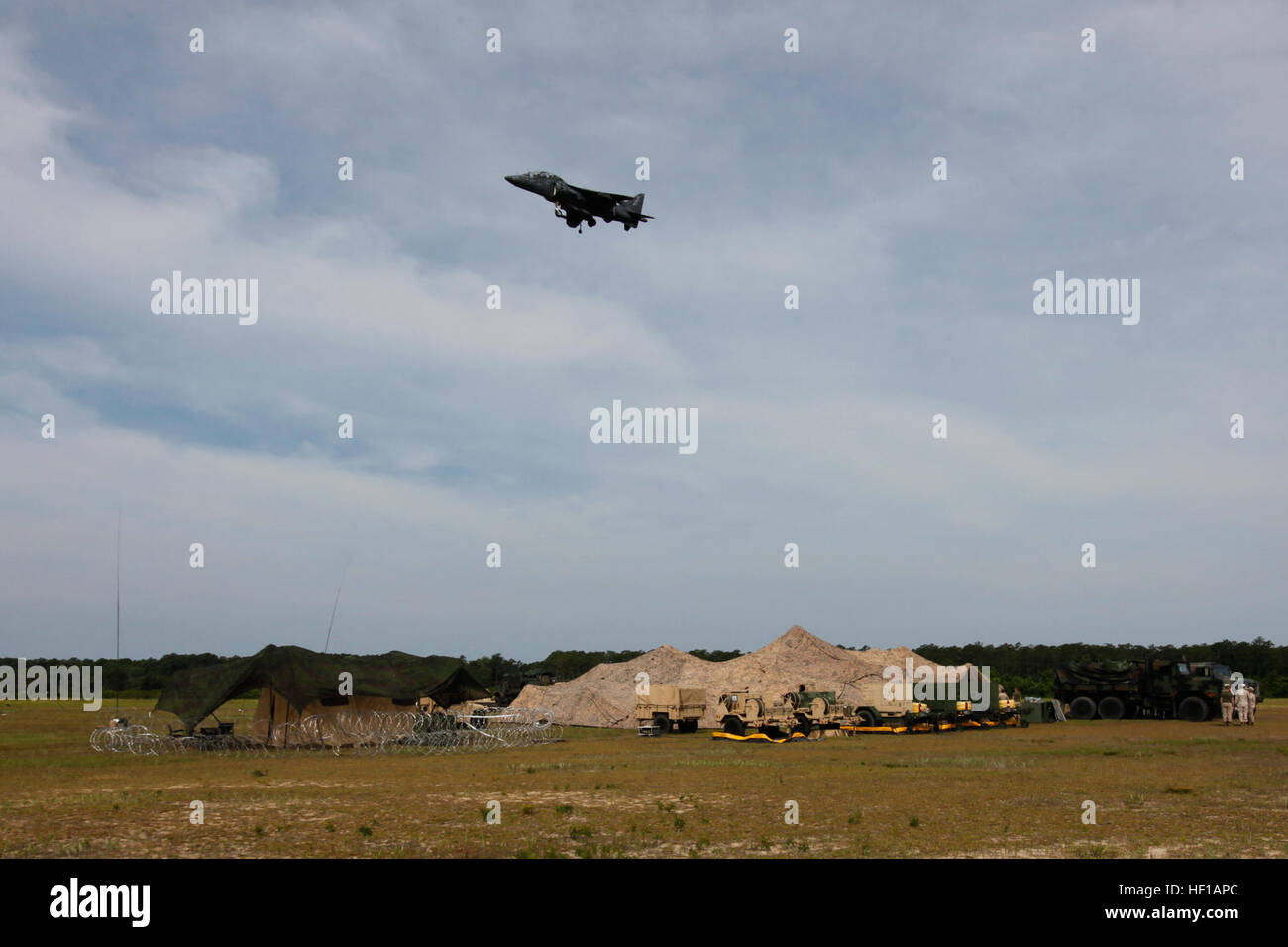An AV-8B Harrier conducts a flight over the Direct Air Support Center ...