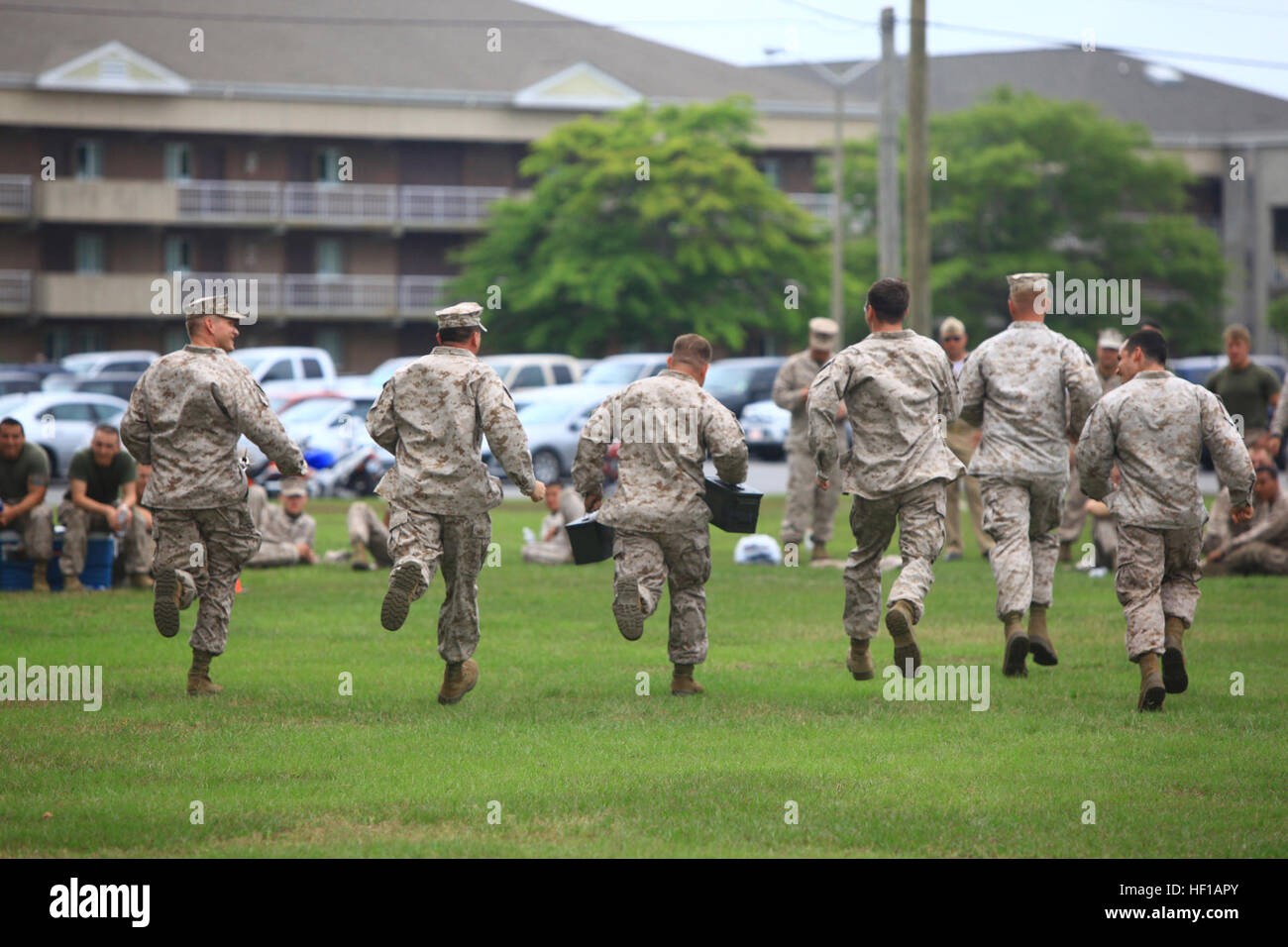 Service members with 2nd Marine Logistics Group motivate a sailor ...
