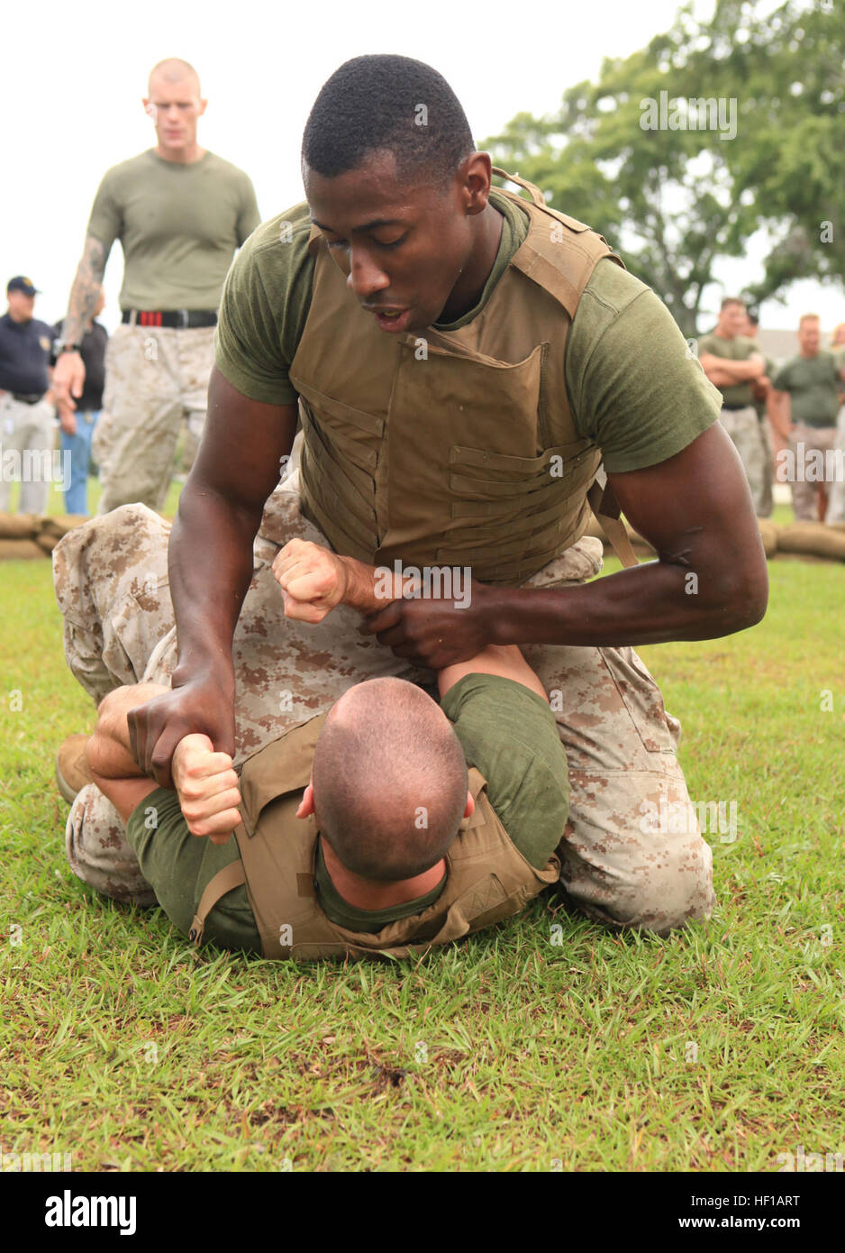 U.S. Marine Corps Sgt. Darnell Price (top) a data network specialist ...
