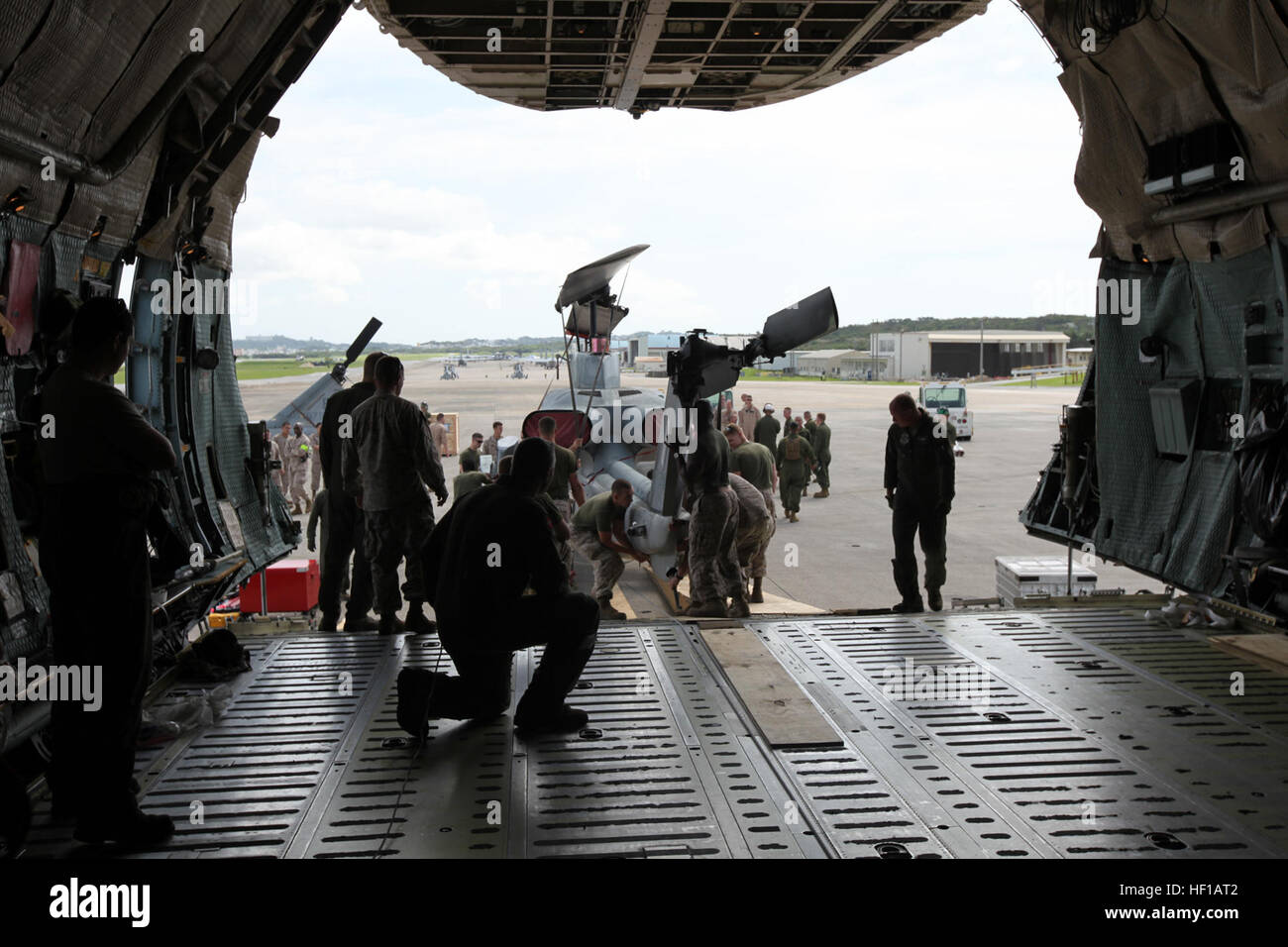 Marines from Marine Heavy Helicopter Squadron 772 (HMH-772) off load an ...