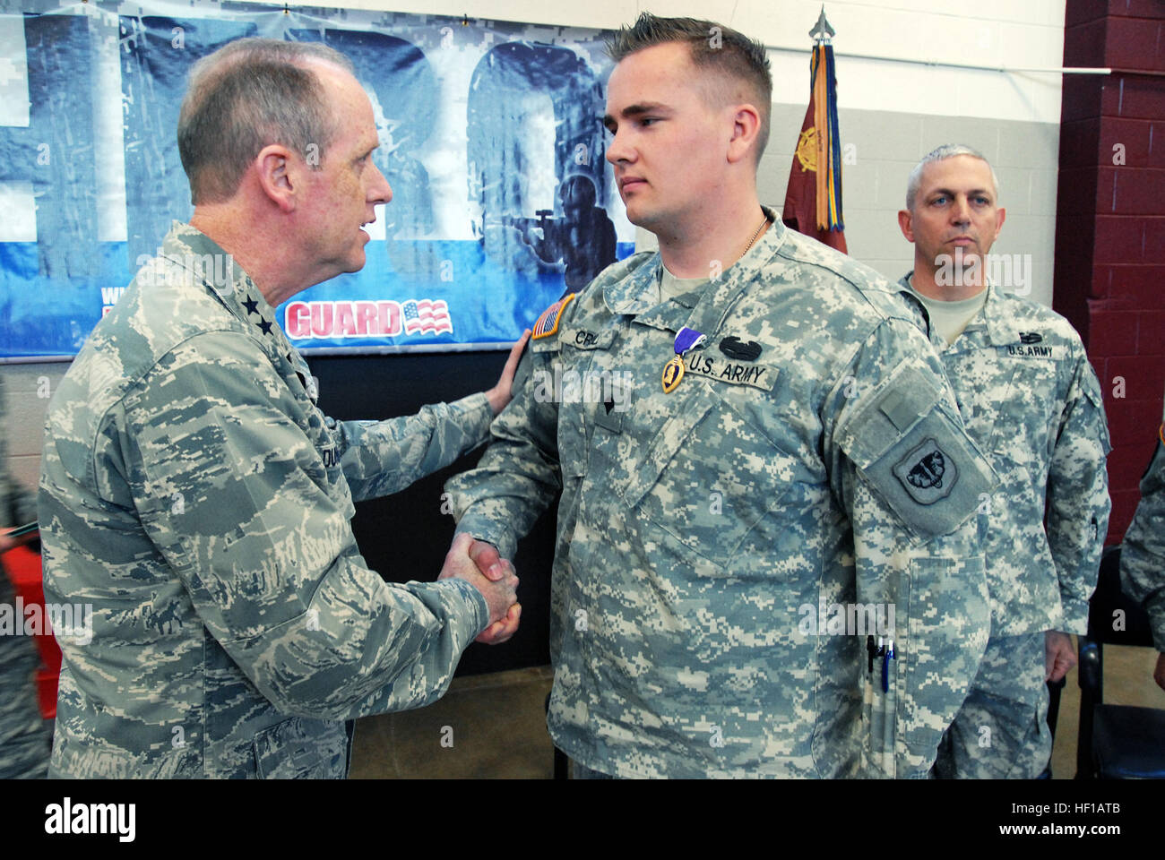 Maj. Gen. Donald Dunbar, the adjutant general of Wisconsin, awards the ...