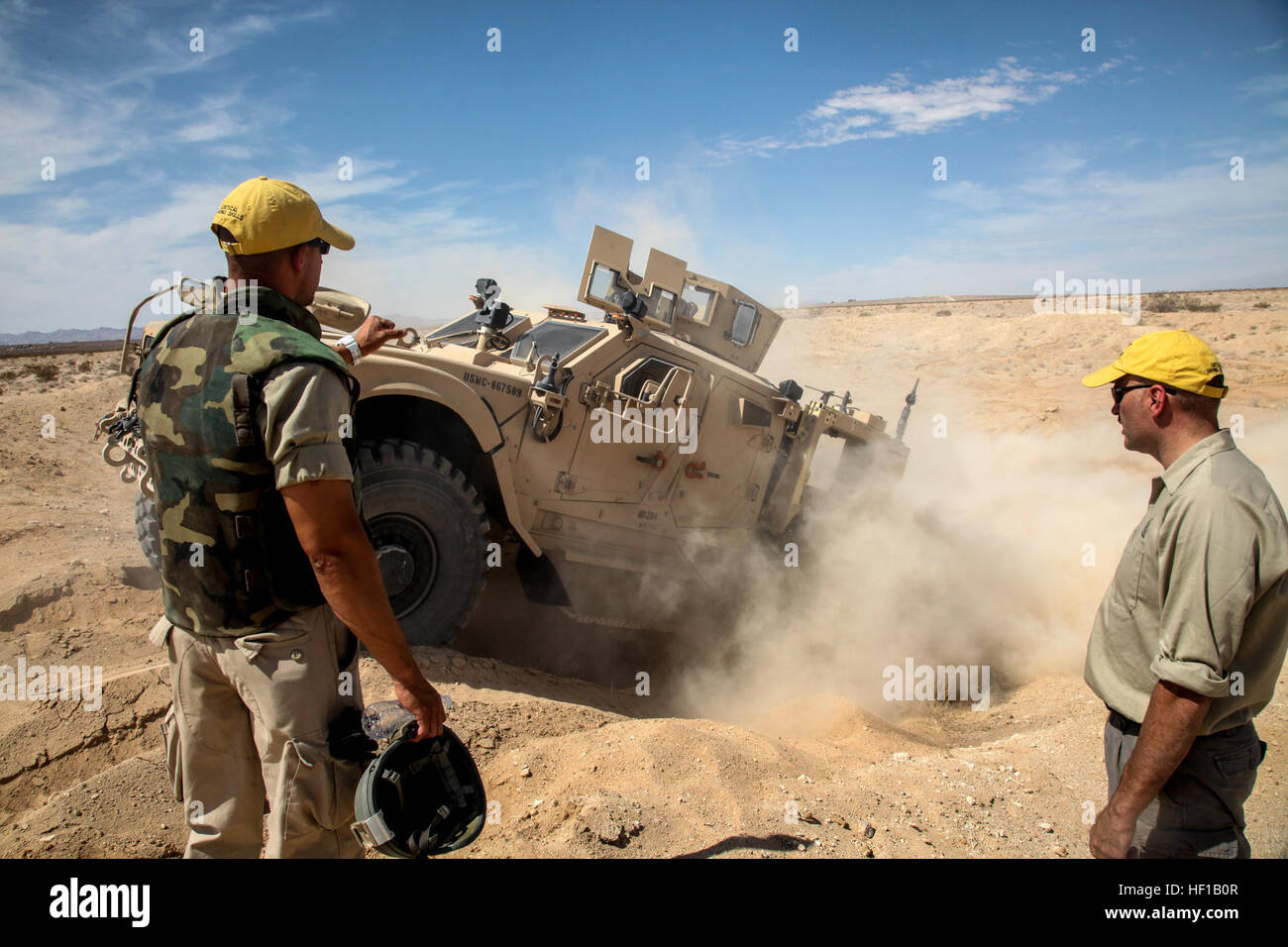 Two course instructors watch as a Mine Resistant, Ambush Protected ...