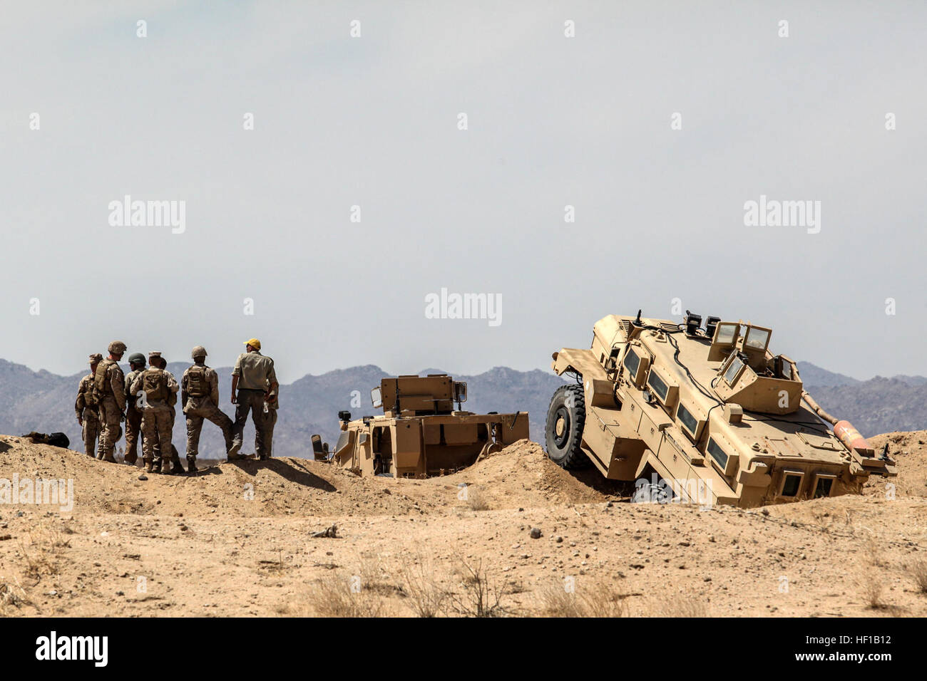 U.S. Marines with 3rd Battalion, 7th Marine Regiment, observe as a Mine ...