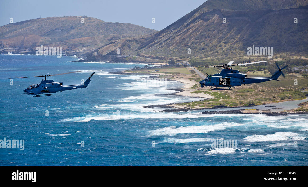 An UH-1W Supercobra and a UH-1Y Venom with Marine Light Attack ...