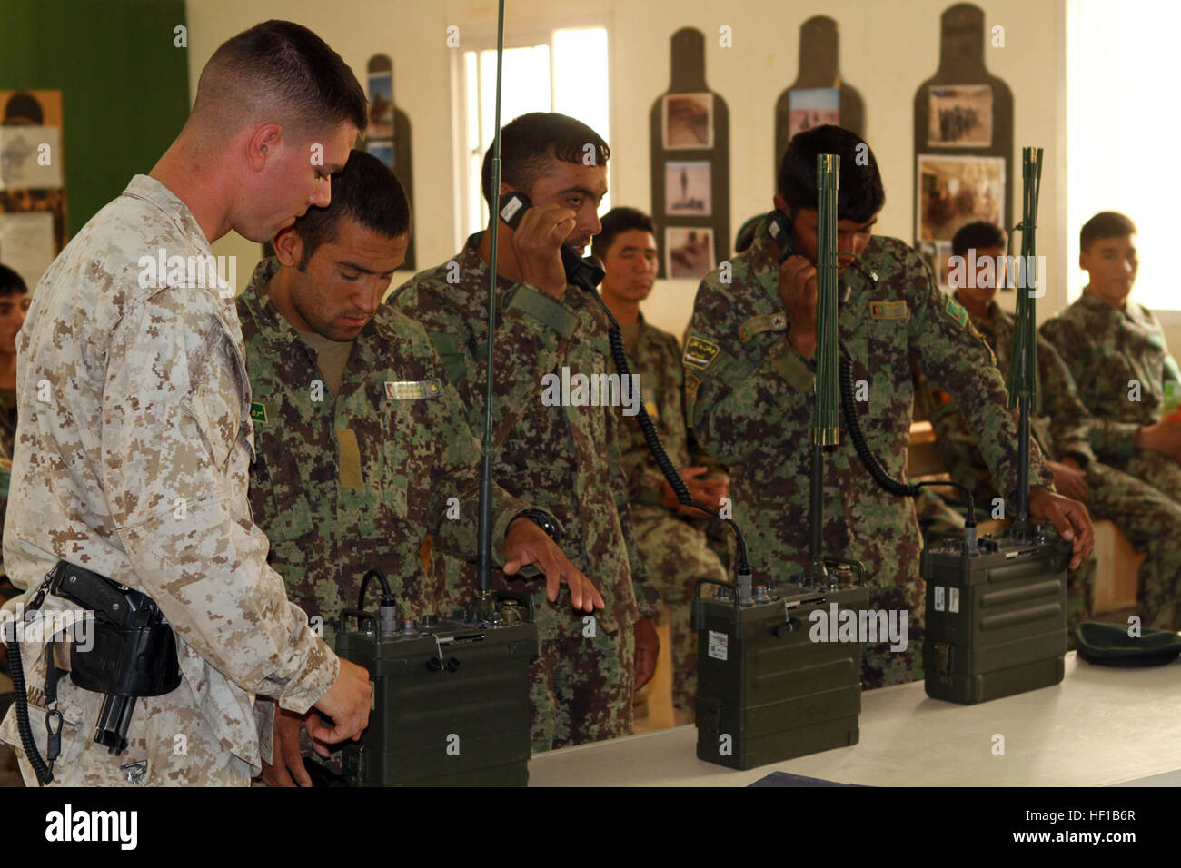 Corporal Bradley Mall, a radio operator with the Signals Kandak Advisor ...