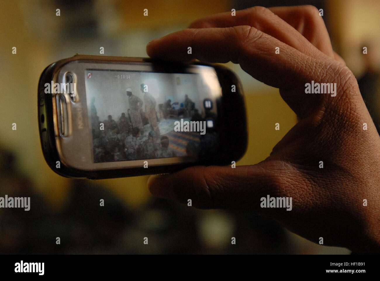 A cell phone, held by an Afghan National Army soldier, records U.S Army ...