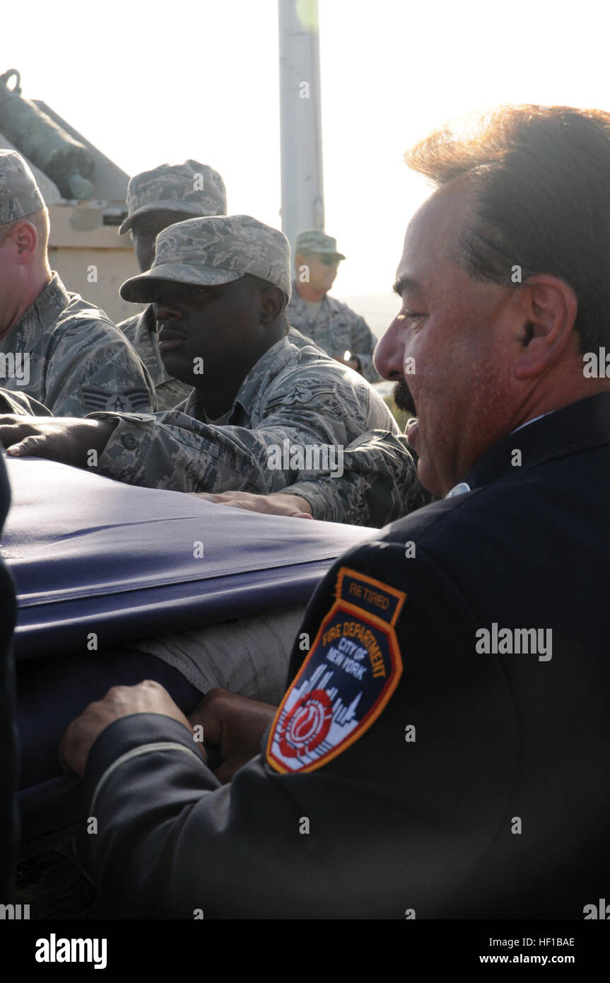 Retired New York City Fire Department Lt. Joe Torrillo assists members ...
