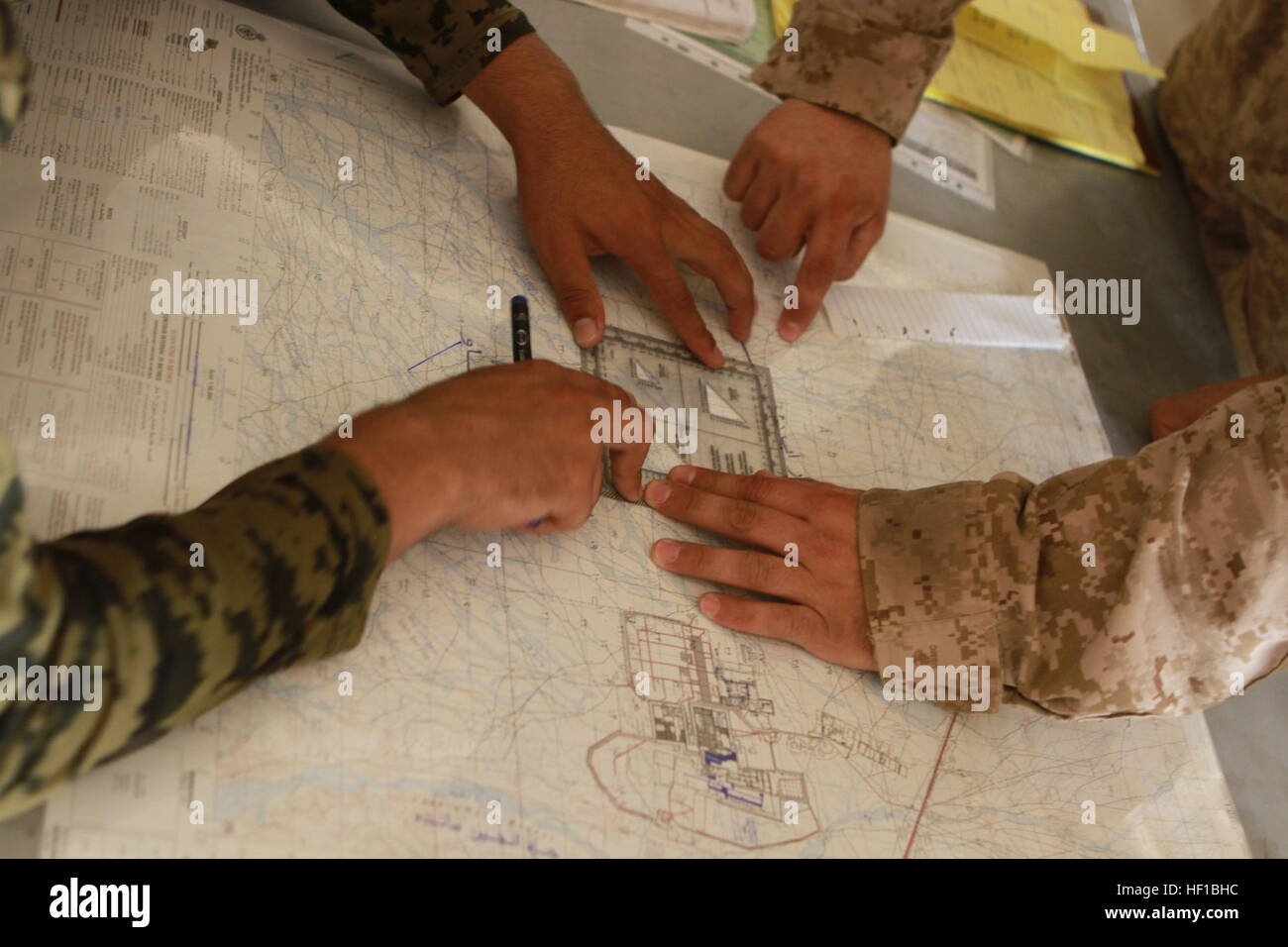 Afghan National Army soldiers plot targets on a map during the forward ...