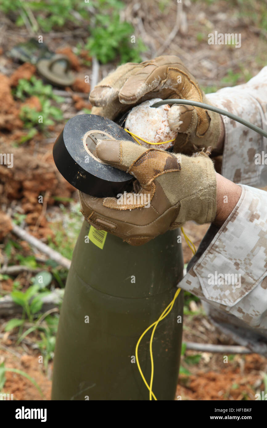 A Marine with 3rd Explosive Ordnance Company puts together a mock ...