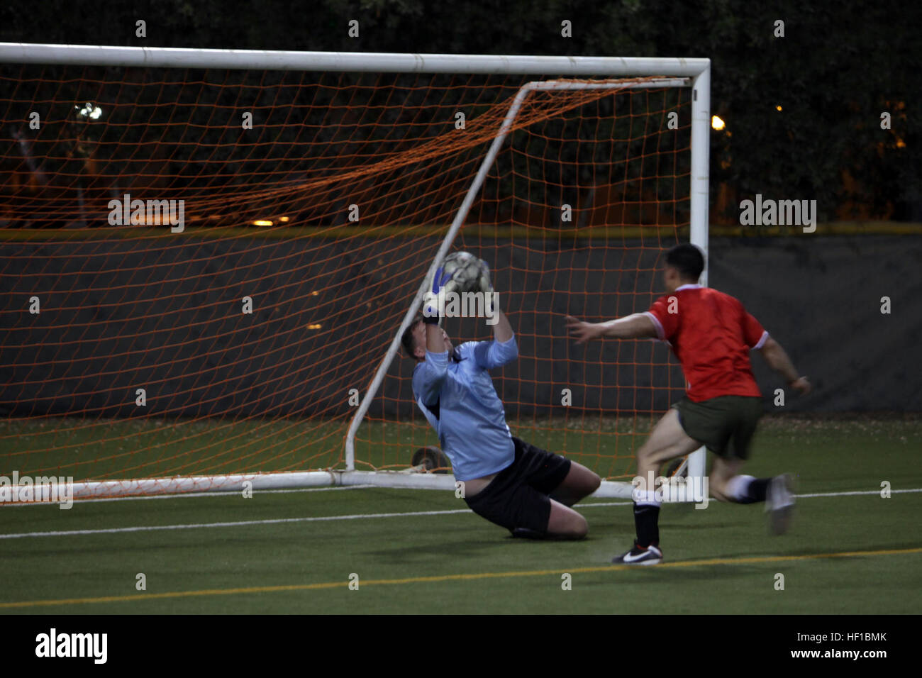 Ammunition technician participates in an intramural soccer game at ...