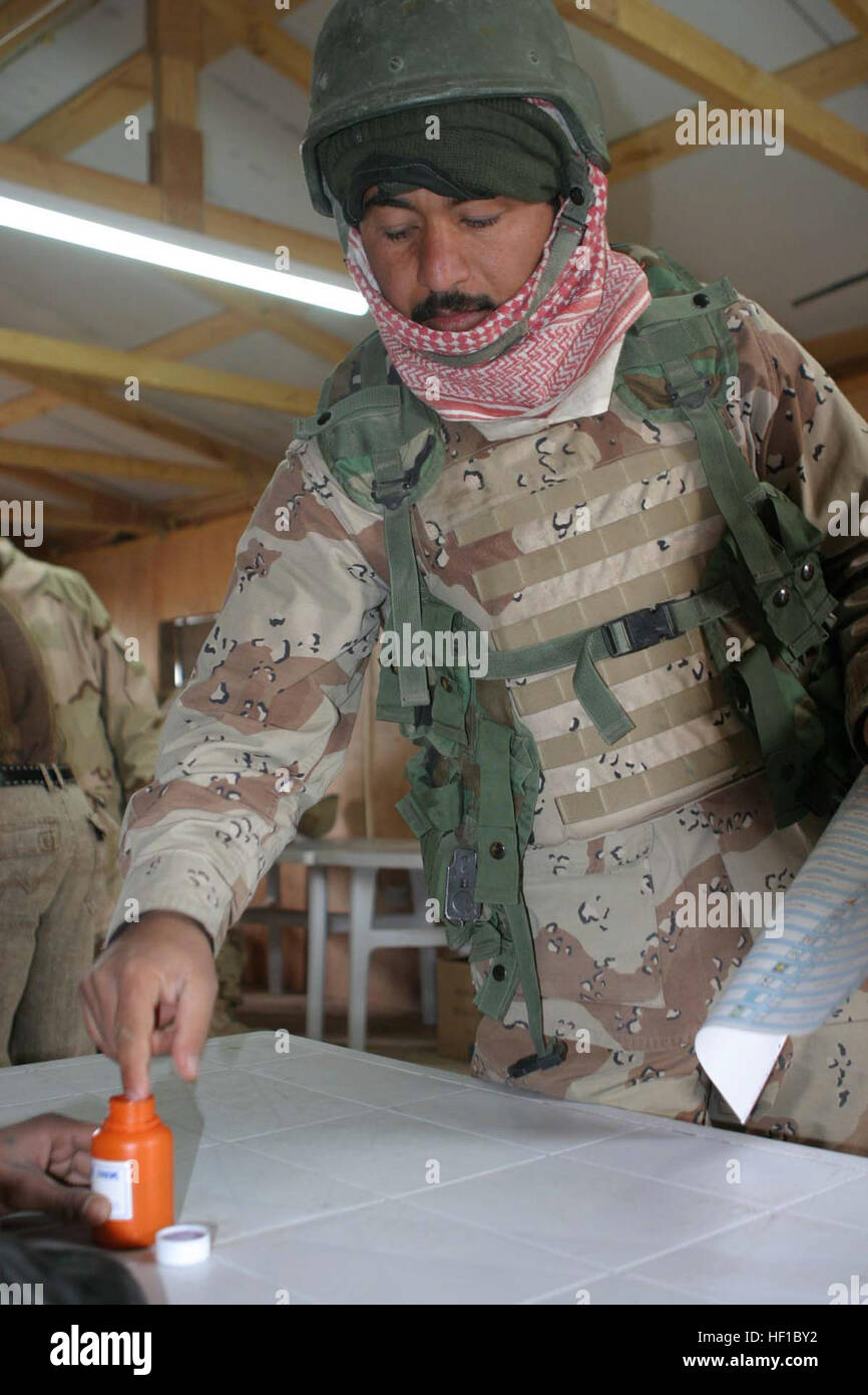 HADITHA DAM, Iraq (Dec. 12, 2005) - An Iraqi soldier sticks his finger ...