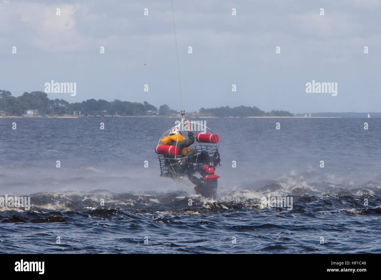 Marines with Marine Transport Squadron 1 (VMR-1) are hoisted to safety ...