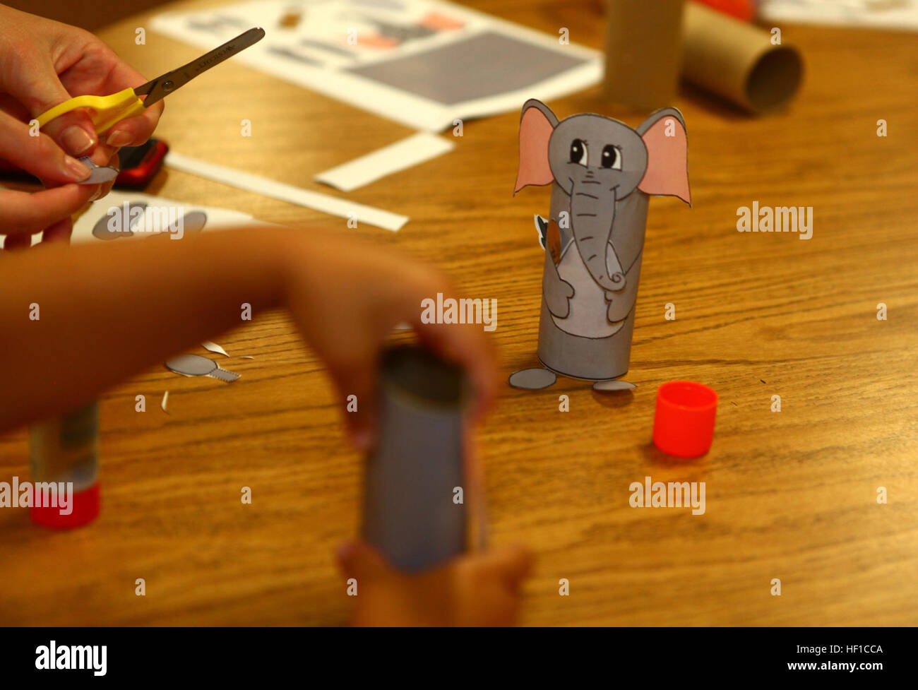 A finished cardboard roll elephant is displayed for children to copy at ...