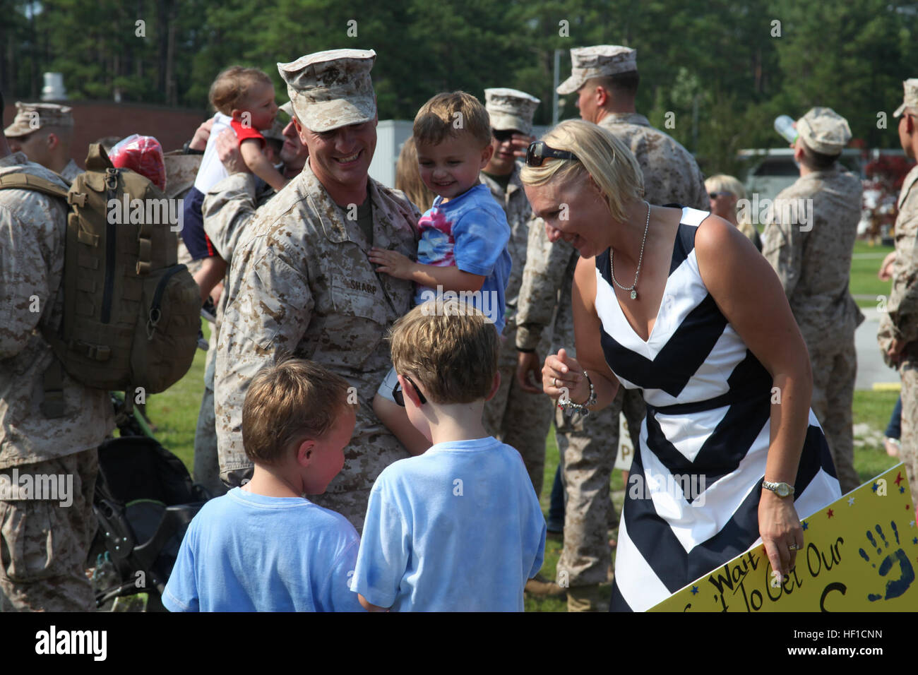 Maj. Jason Sharp greets his family as he returns to Marine Air Control ...