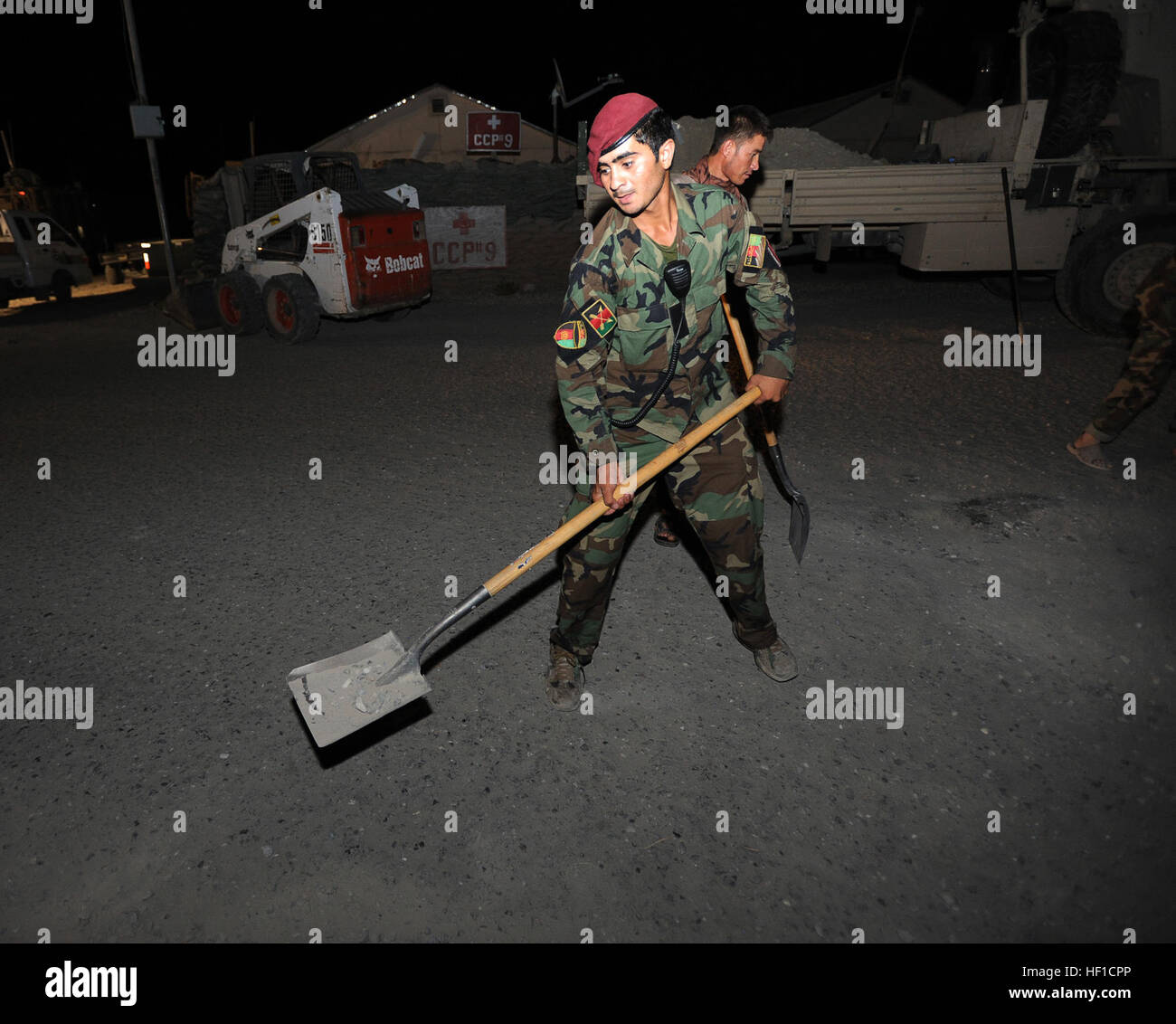 Ibrahim, a commando, 1st Commando Kandak, Afghan National Army shovels ...