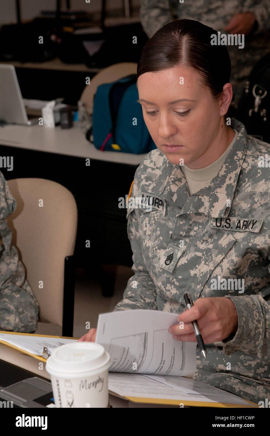 Staff Sgt. Sophie Murphy, 105th Military Police Battalion, reviews ...