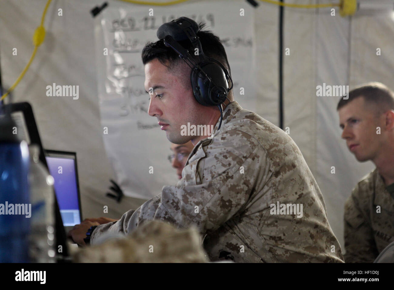 U.S. Marines assigned to Marine Air Control Group 48, look over radar ...