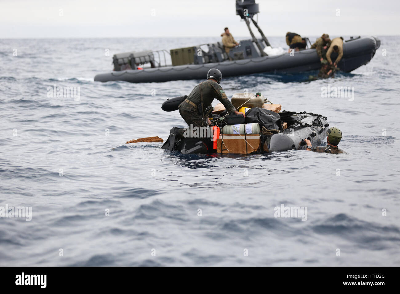 U.S. Marines board an F470 Zodiac combat rubber raiding craft after ...