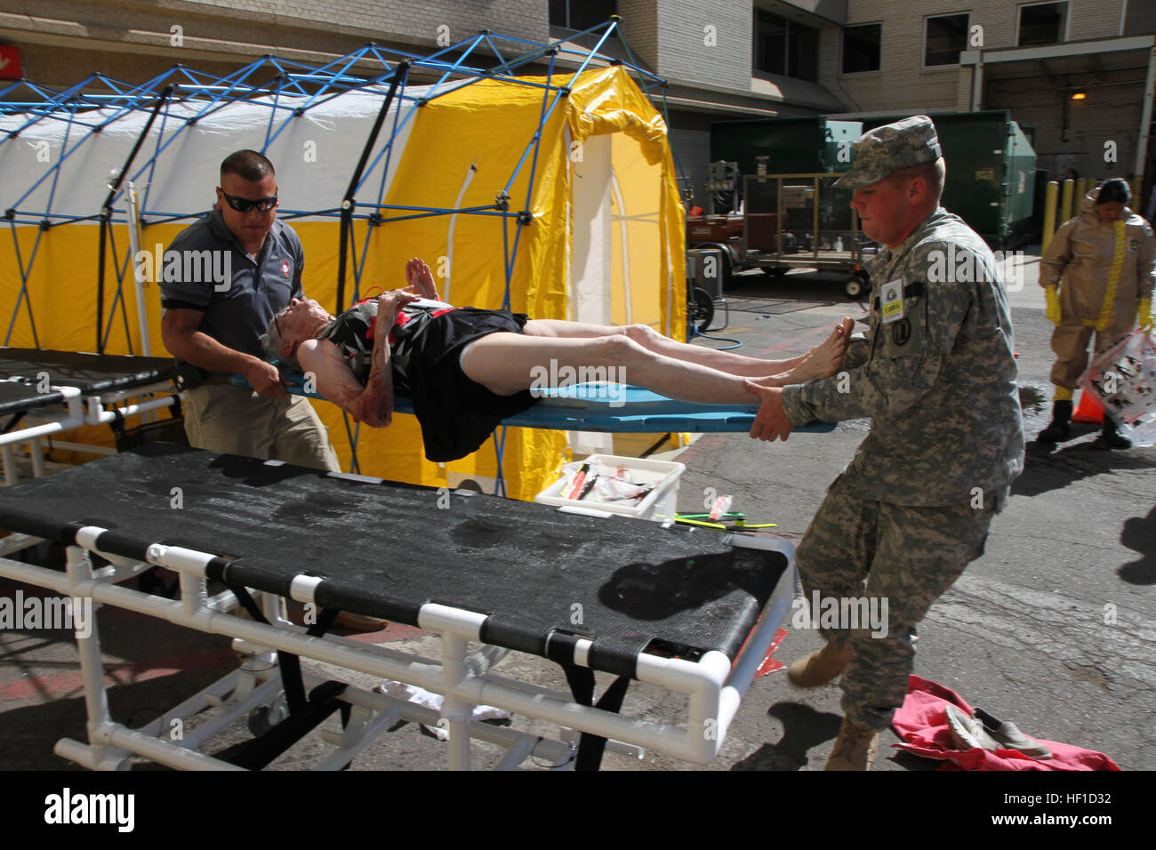 U.S. Army Sgt. Cooper Allen, foreground right, a chemical agent ...