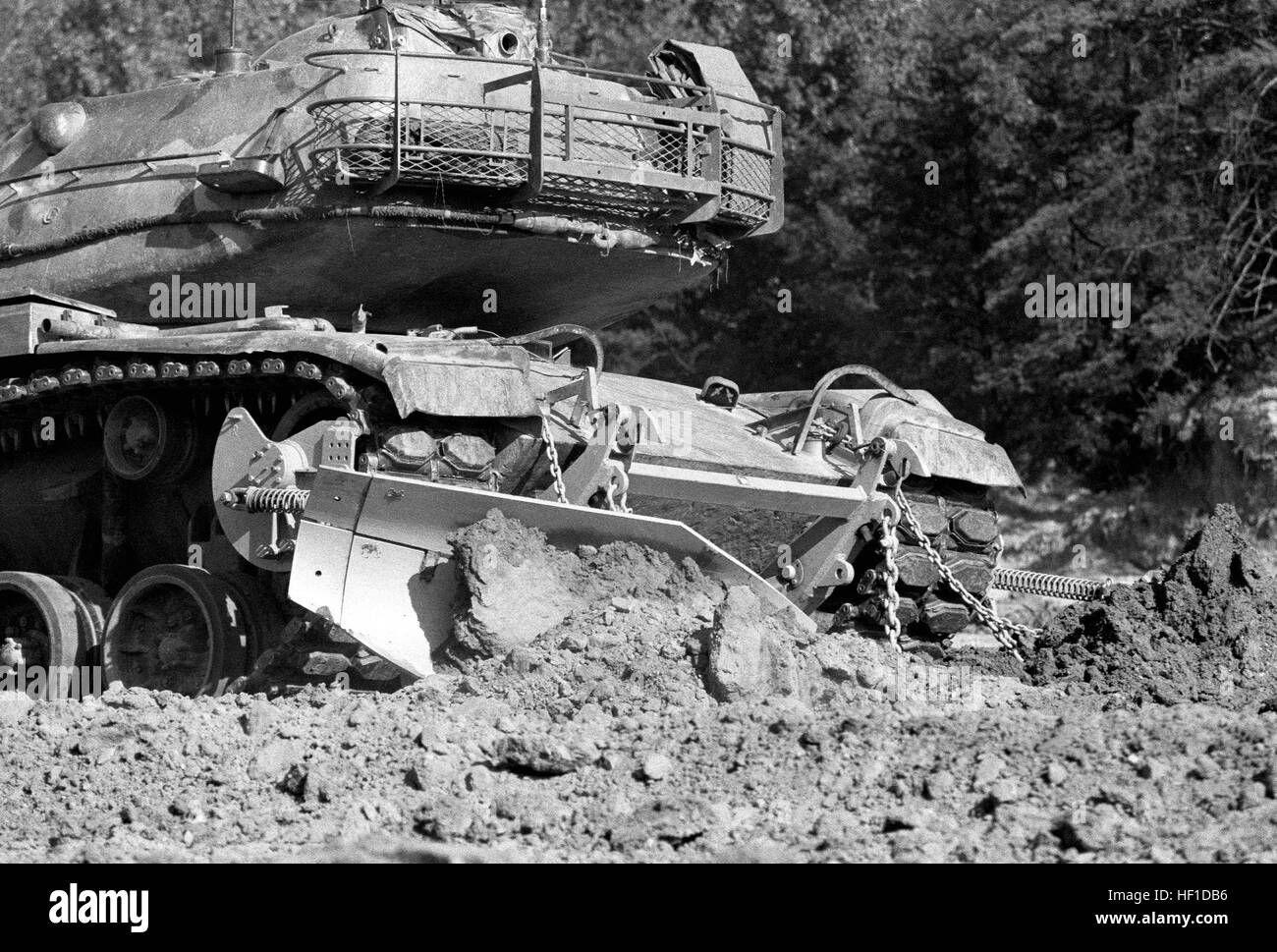 A right front view of an M60 main battle tank, equipped with a track ...