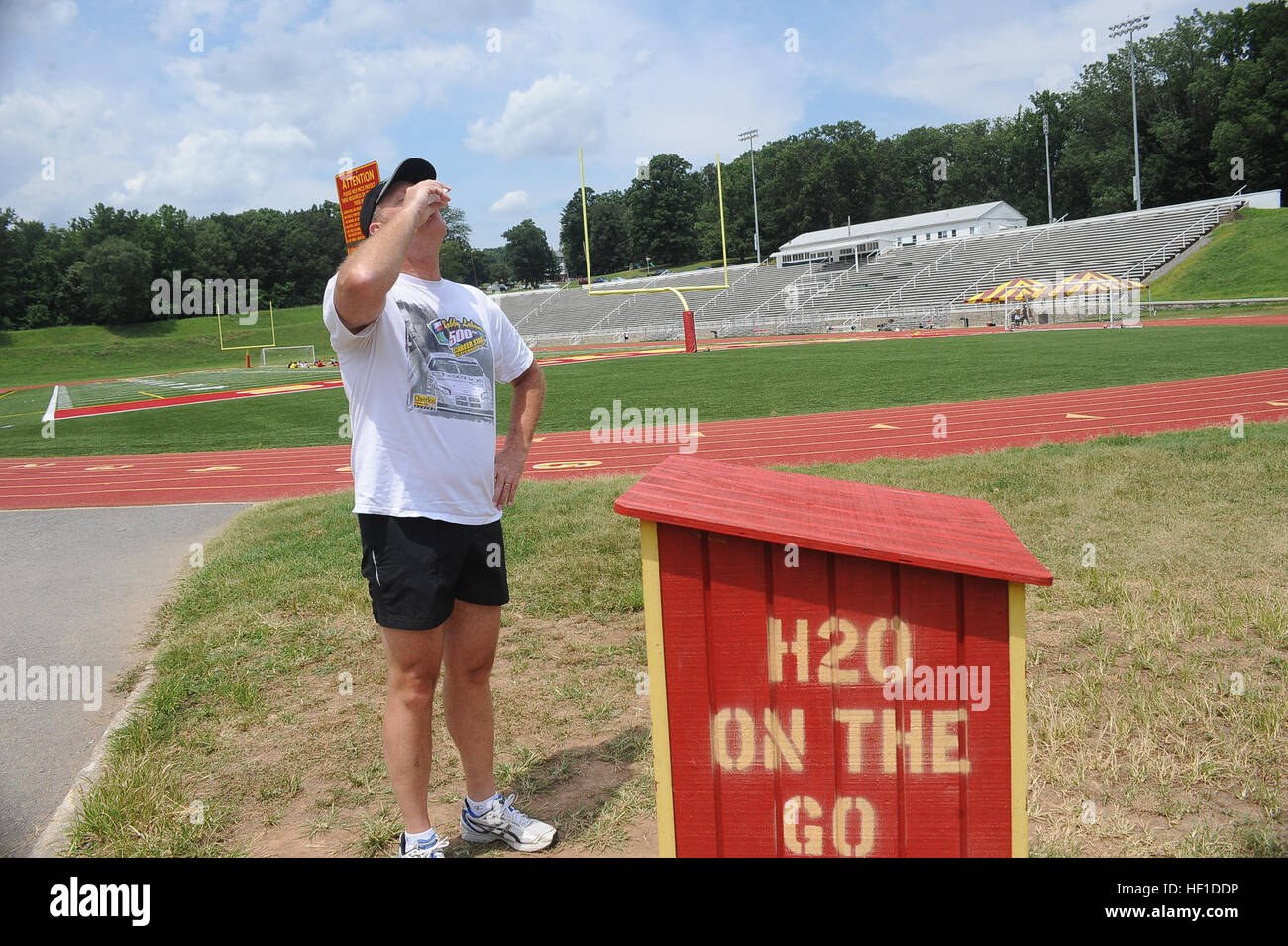 Marchar Bison, 53, uses the H20 water station after a long run at ...
