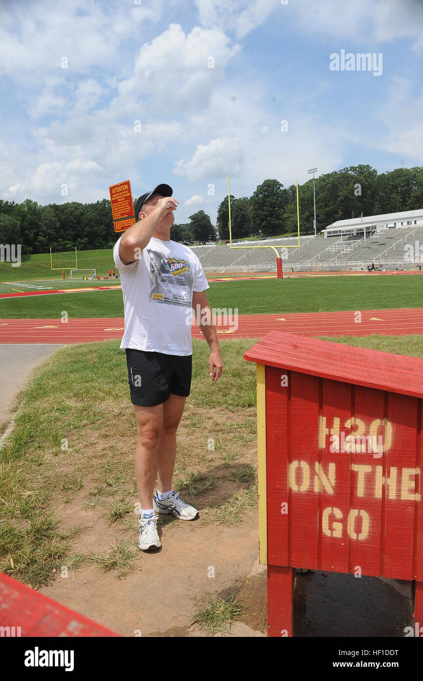 Marchar Bison, 53, uses the H20 water station after a long run at ...