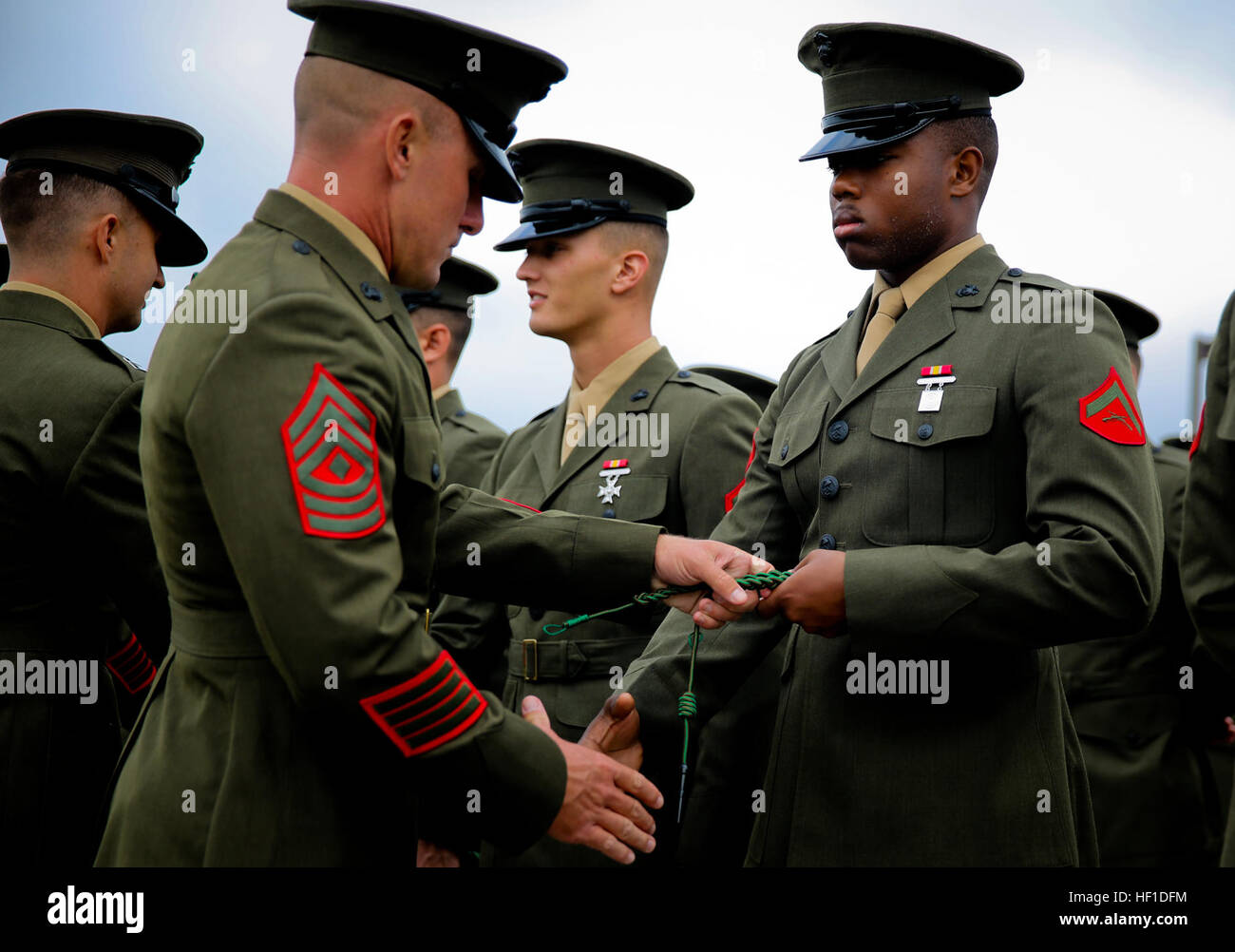 Marines with 5th Marine Regiment are presented the French Fourragere ...
