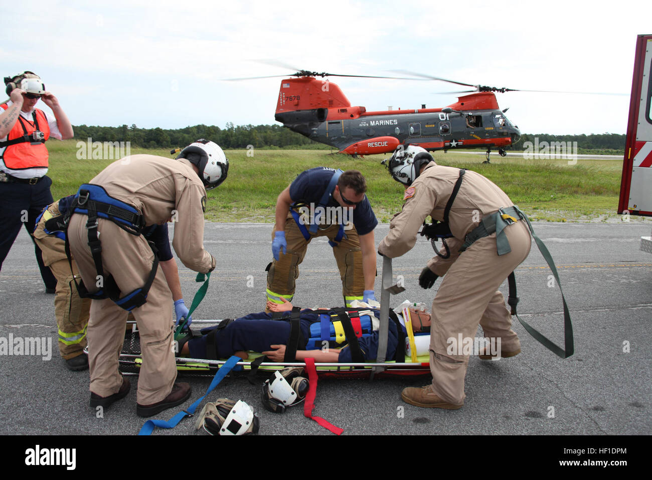 A paramedic with Fire Department 3 and Marines with Marine Transport ...
