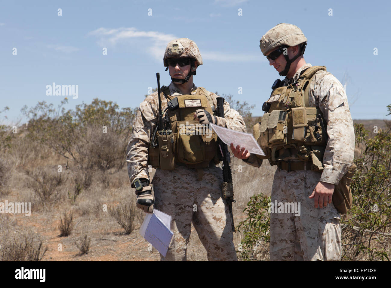 Capt. Colin Culkin, firepower control team leader reviews a map of ...