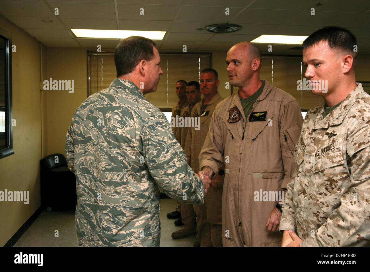 U.S. Air Force Brig. Gen. James B. Hecker, left, presents a coin to U.S ...