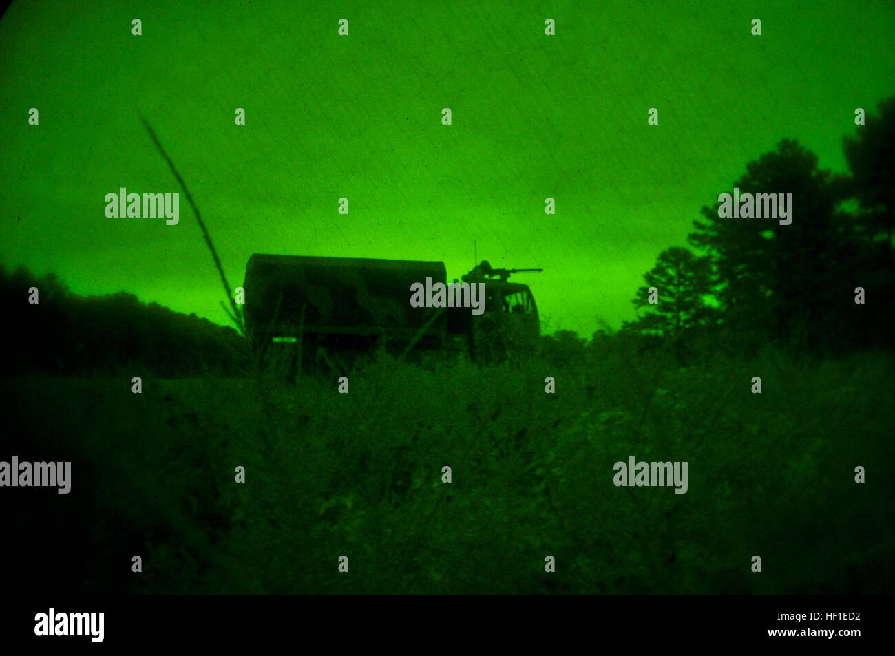 A U.S. Army Light Medium Tactical Vehicle with a 50 caliber machine gun ...