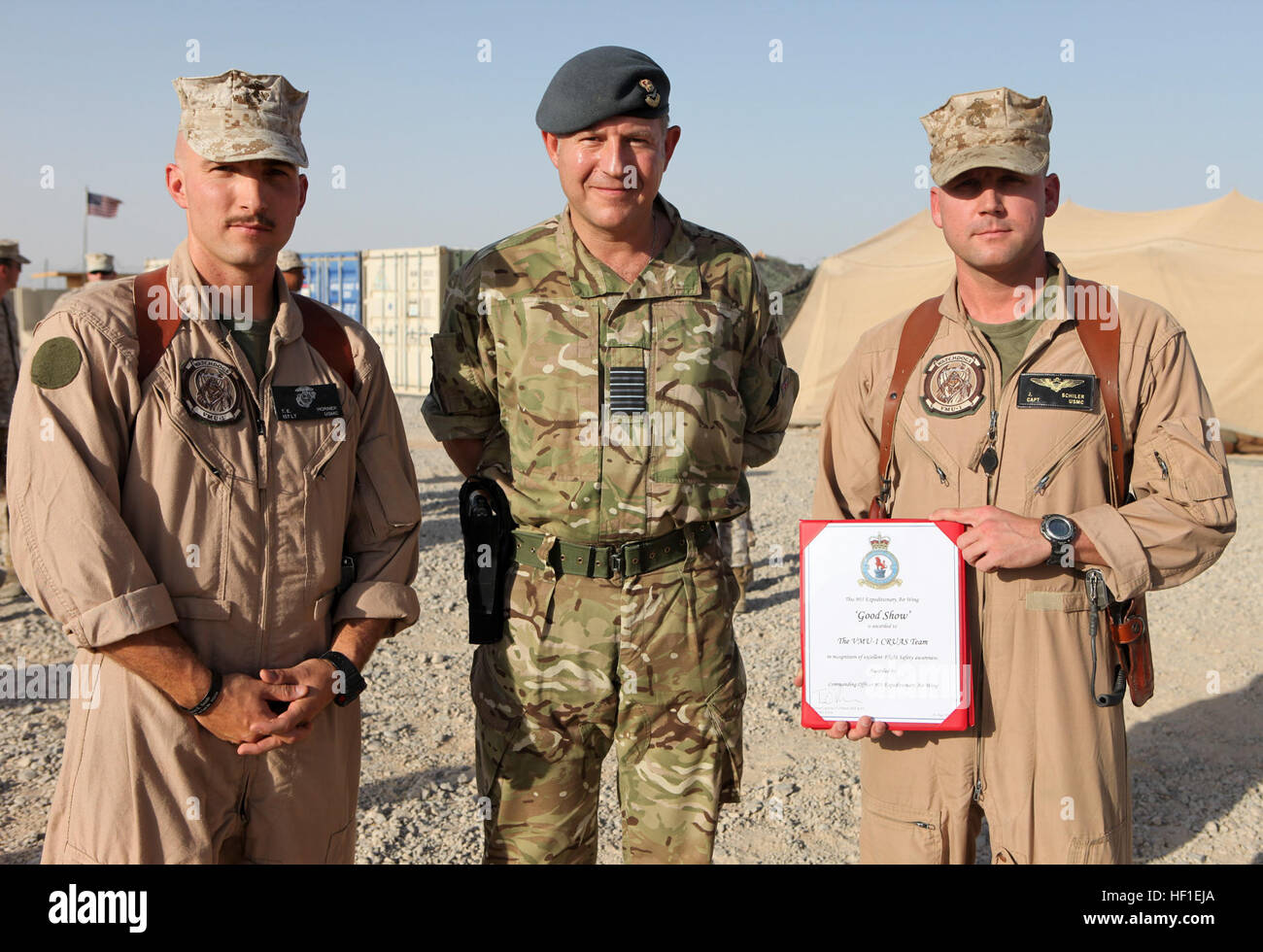 Royal Air Force Group Capt. Tim O'Brien poses with Marine Capt ...