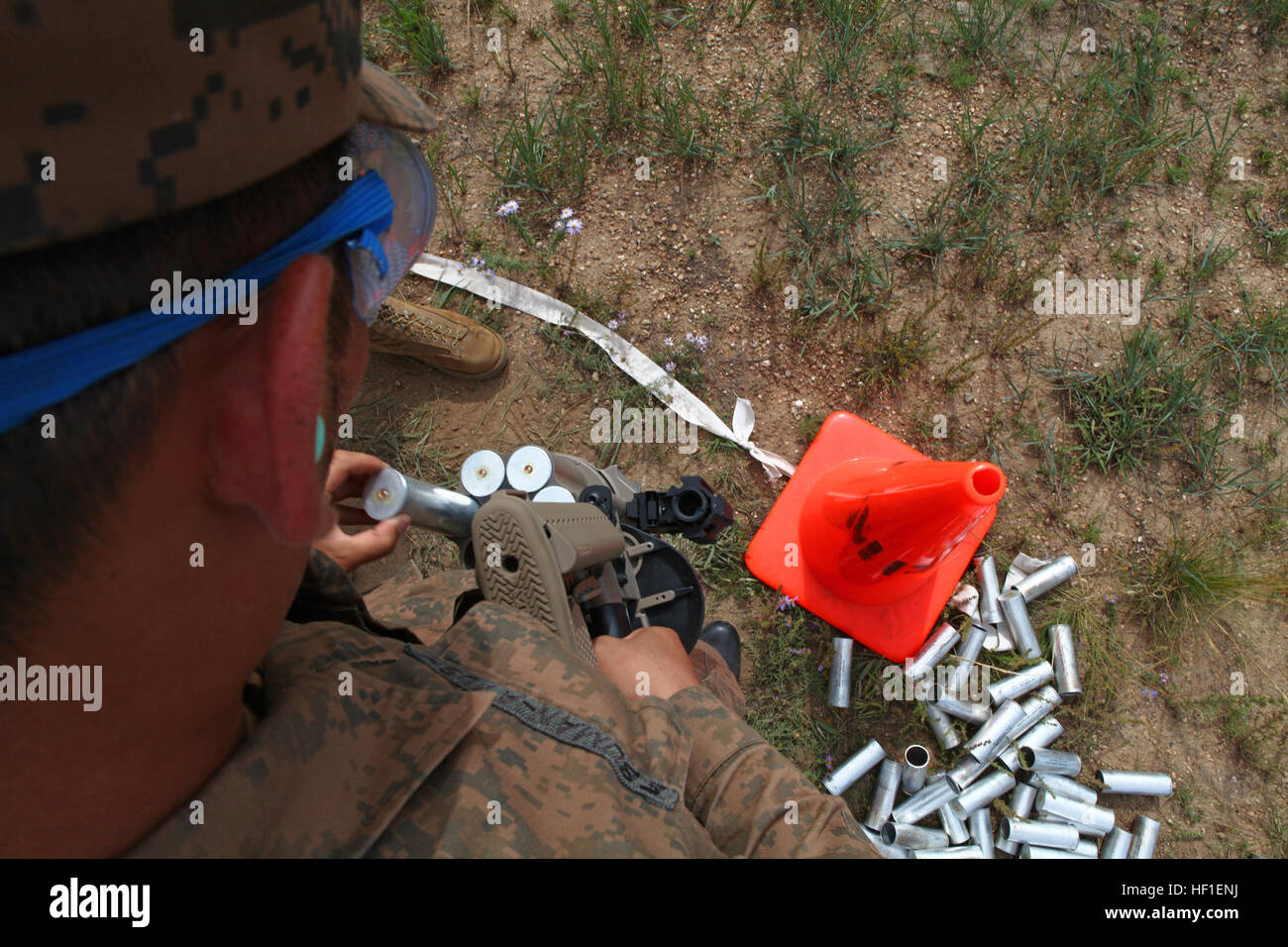 A Mongolian Armed Forces service member loads a 40mm non-lethal rubber ...
